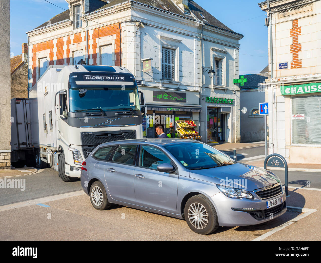 Long lorry and trailer stuck in narrow village street - France Stock ...