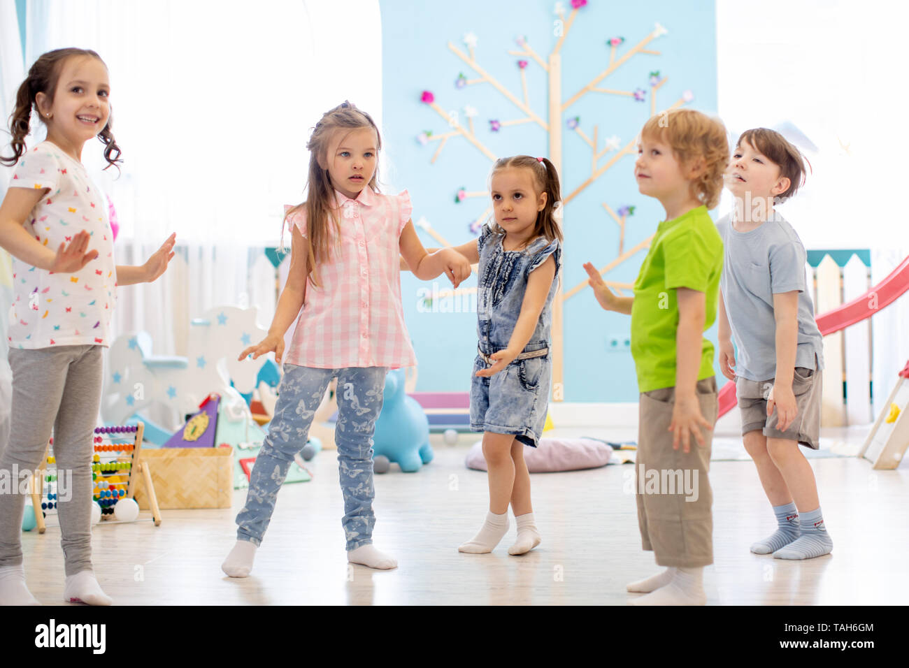 Four dancing children hi-res stock photography and images - Alamy