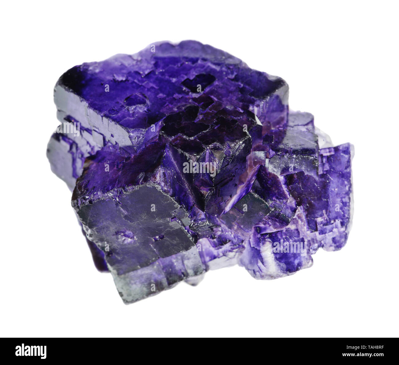 Dark blue fluorite crystals specimen isolated on a white background ...