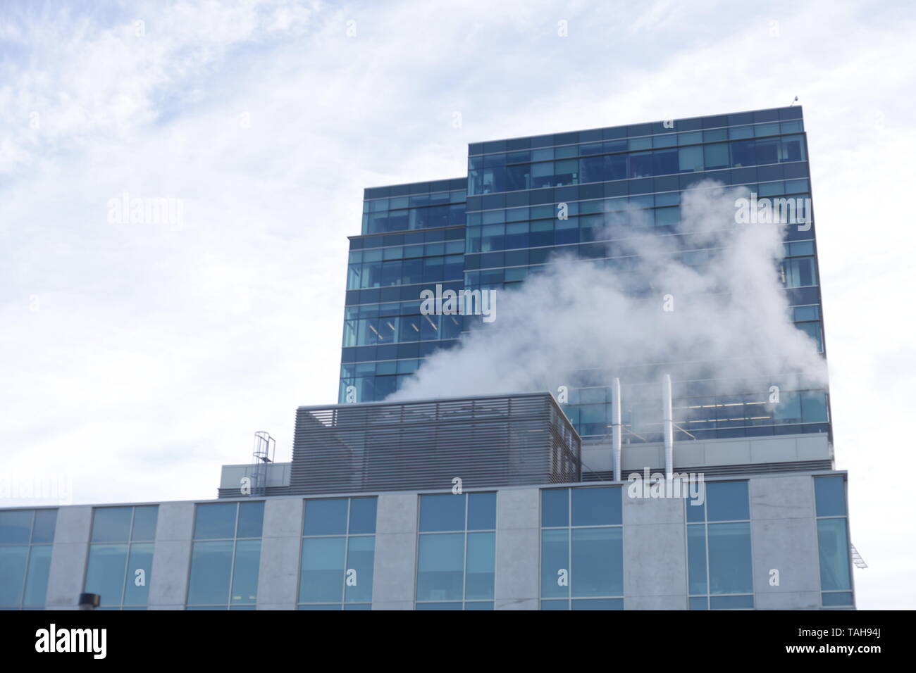 blue building with smoke Stock Photo - Alamy