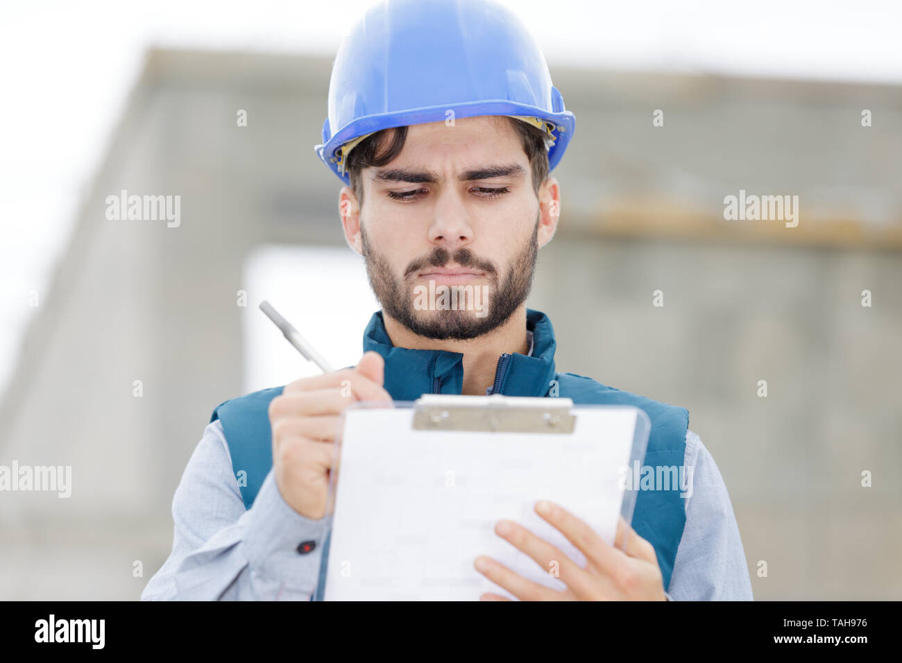 workman with clipboard Stock Photo - Alamy