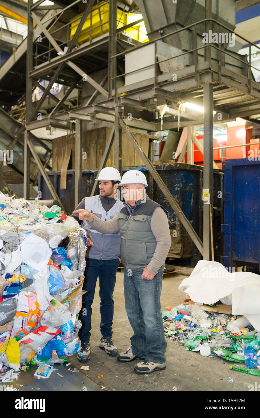 photo of plastic recycling factory workers Stock Photo - Alamy