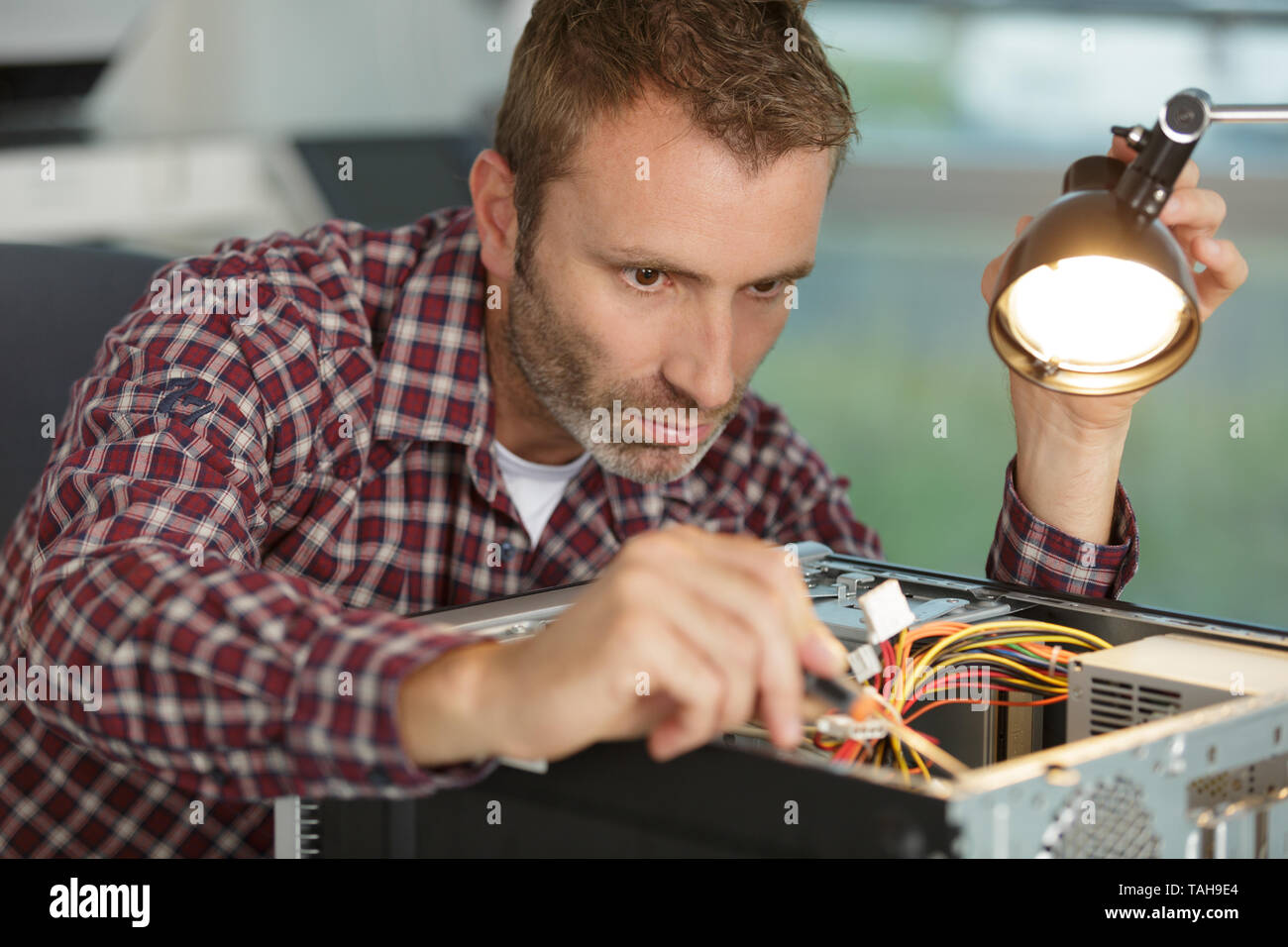 male electrician checking the cables Stock Photo - Alamy