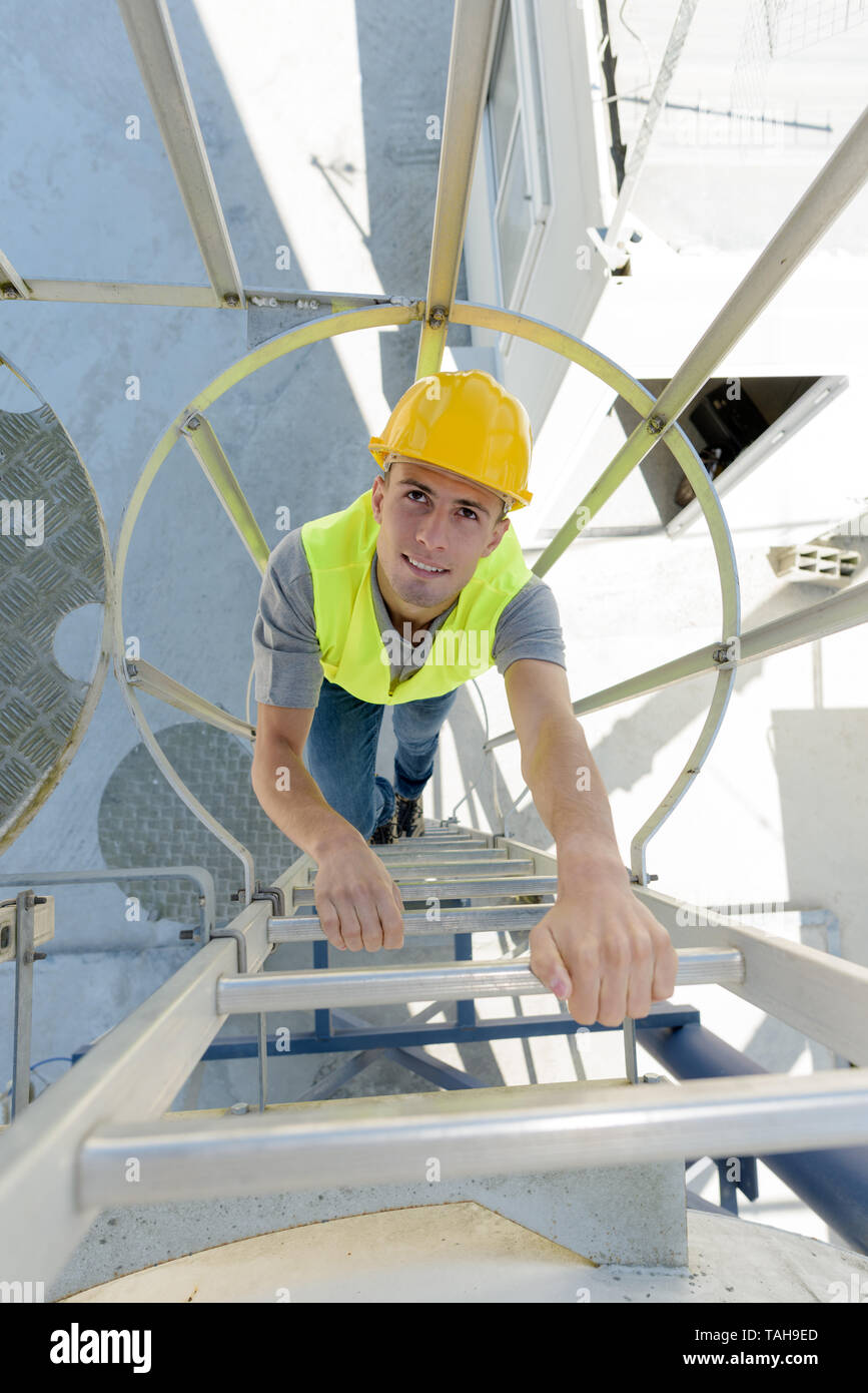 labor construction site worker climbing up steps outdoors Stock Photo ...