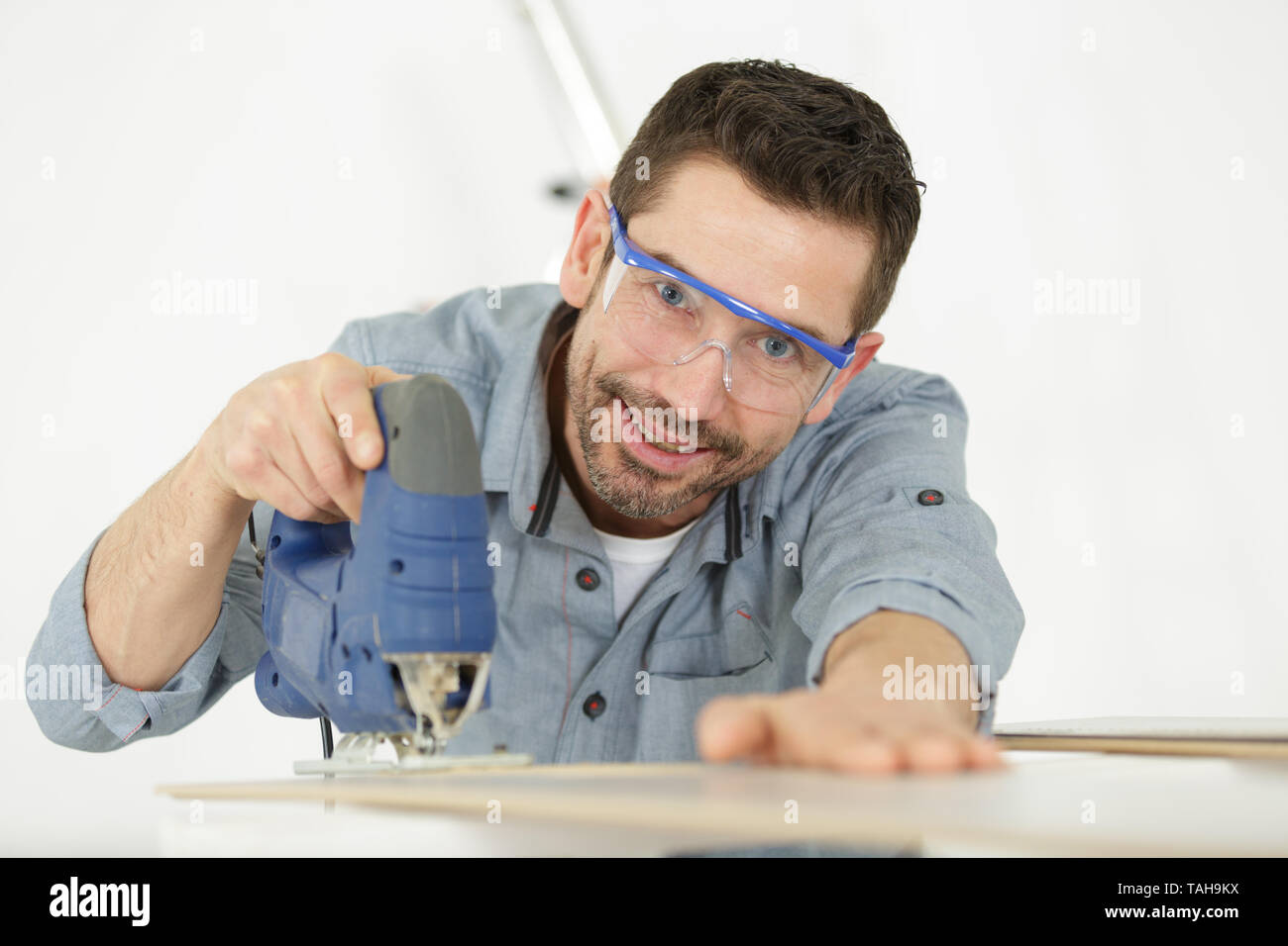 man using a wood machine Stock Photo - Alamy