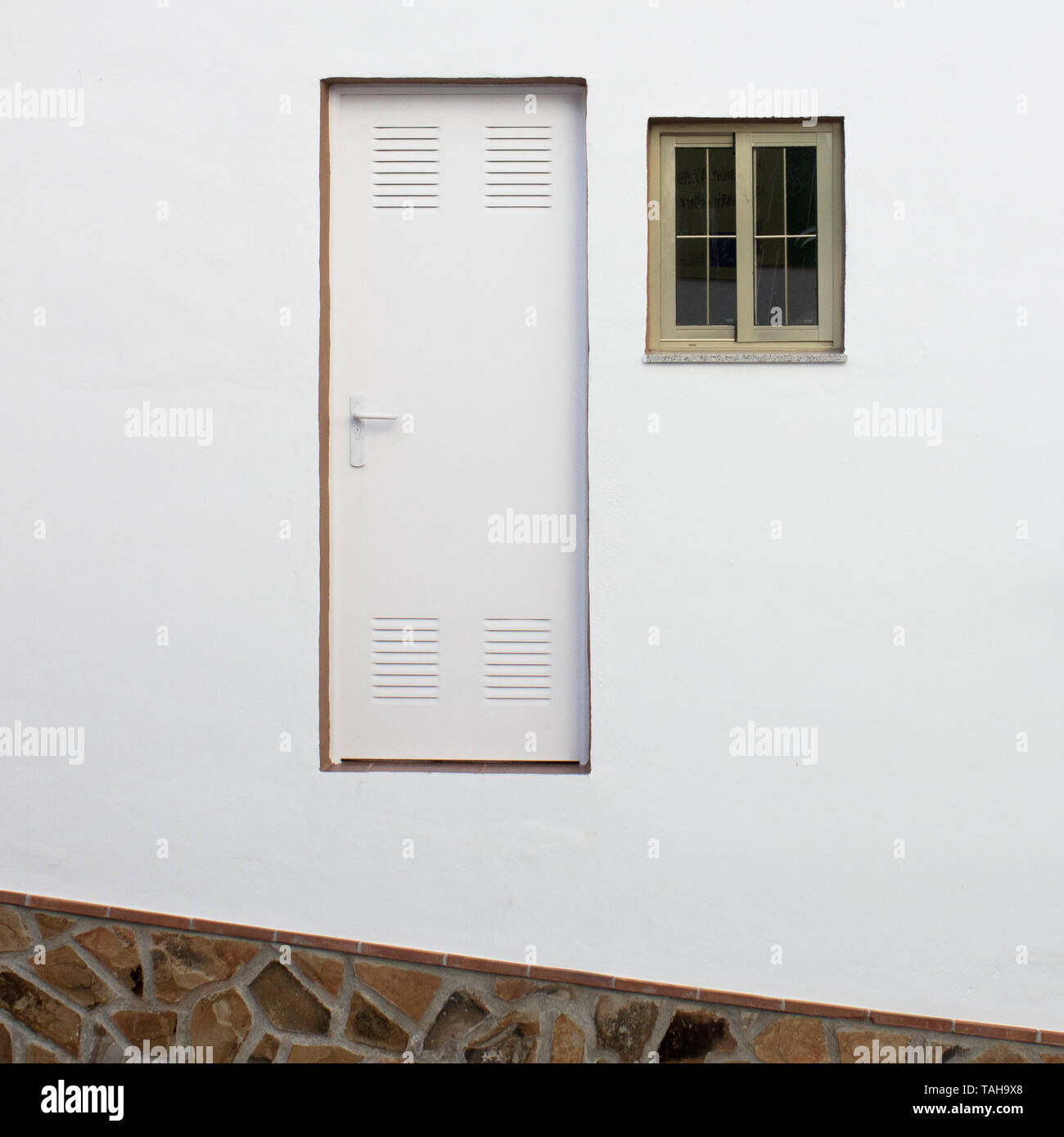 Impossible and minimalistic white door next to a window Stock Photo - Alamy