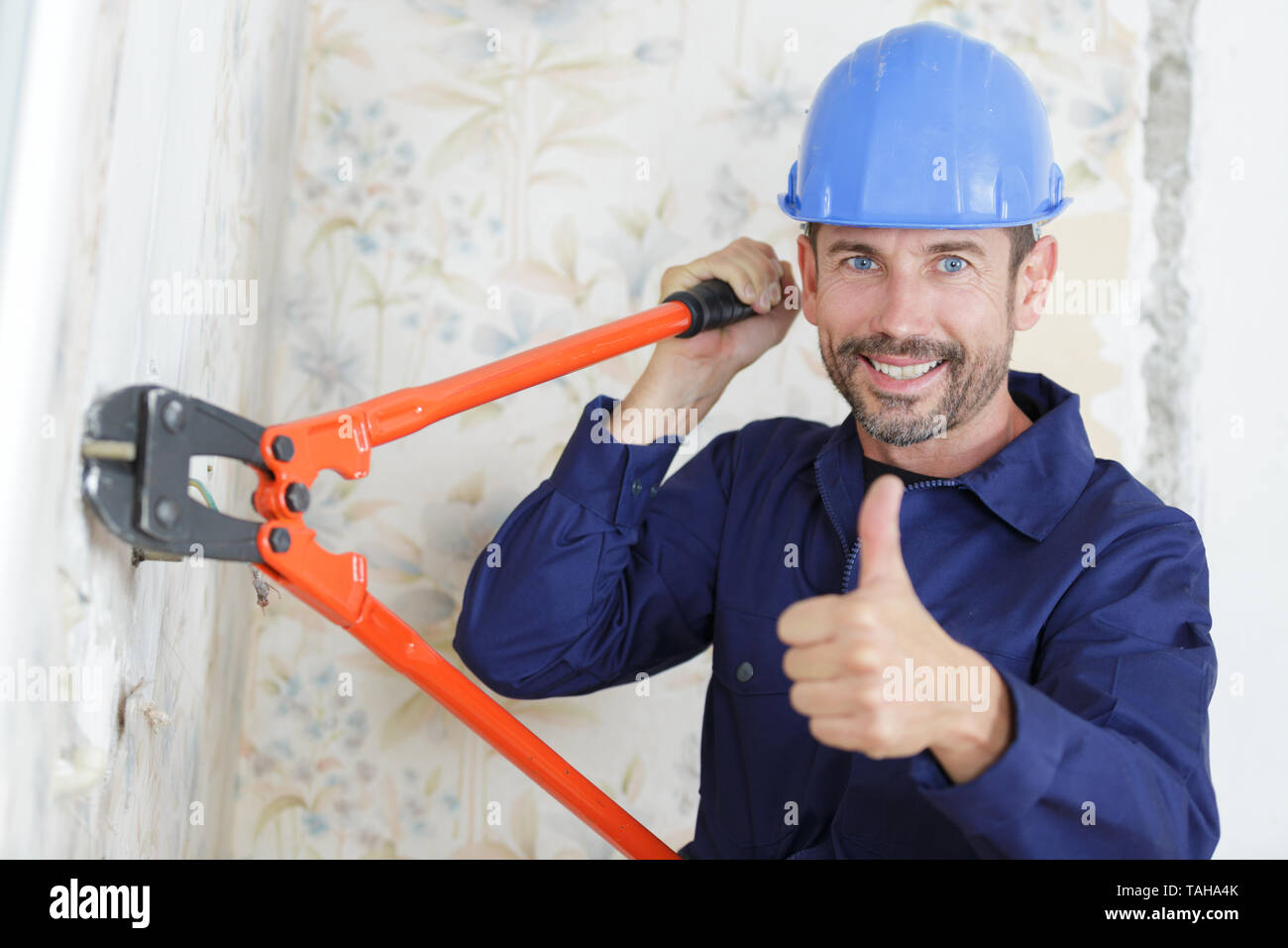 foreman with helmet with thumb-up Stock Photo - Alamy
