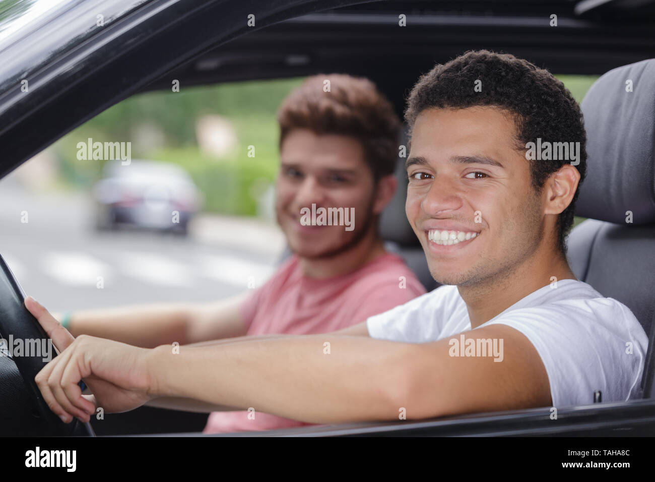 portrait of two young men in a car Stock Photo - Alamy