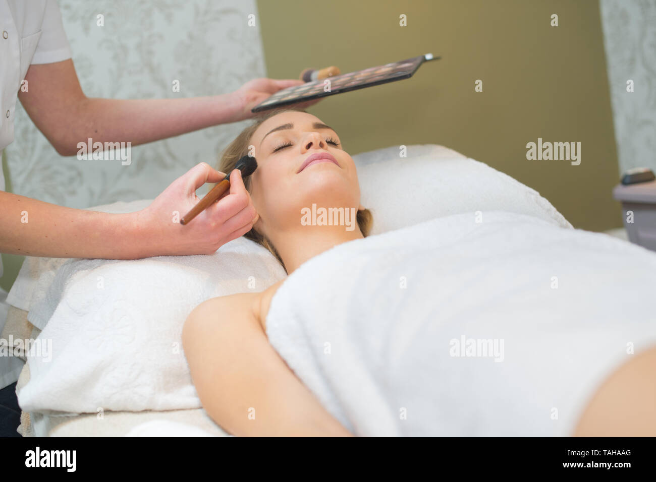 aesthetic beautician serving a client Stock Photo - Alamy