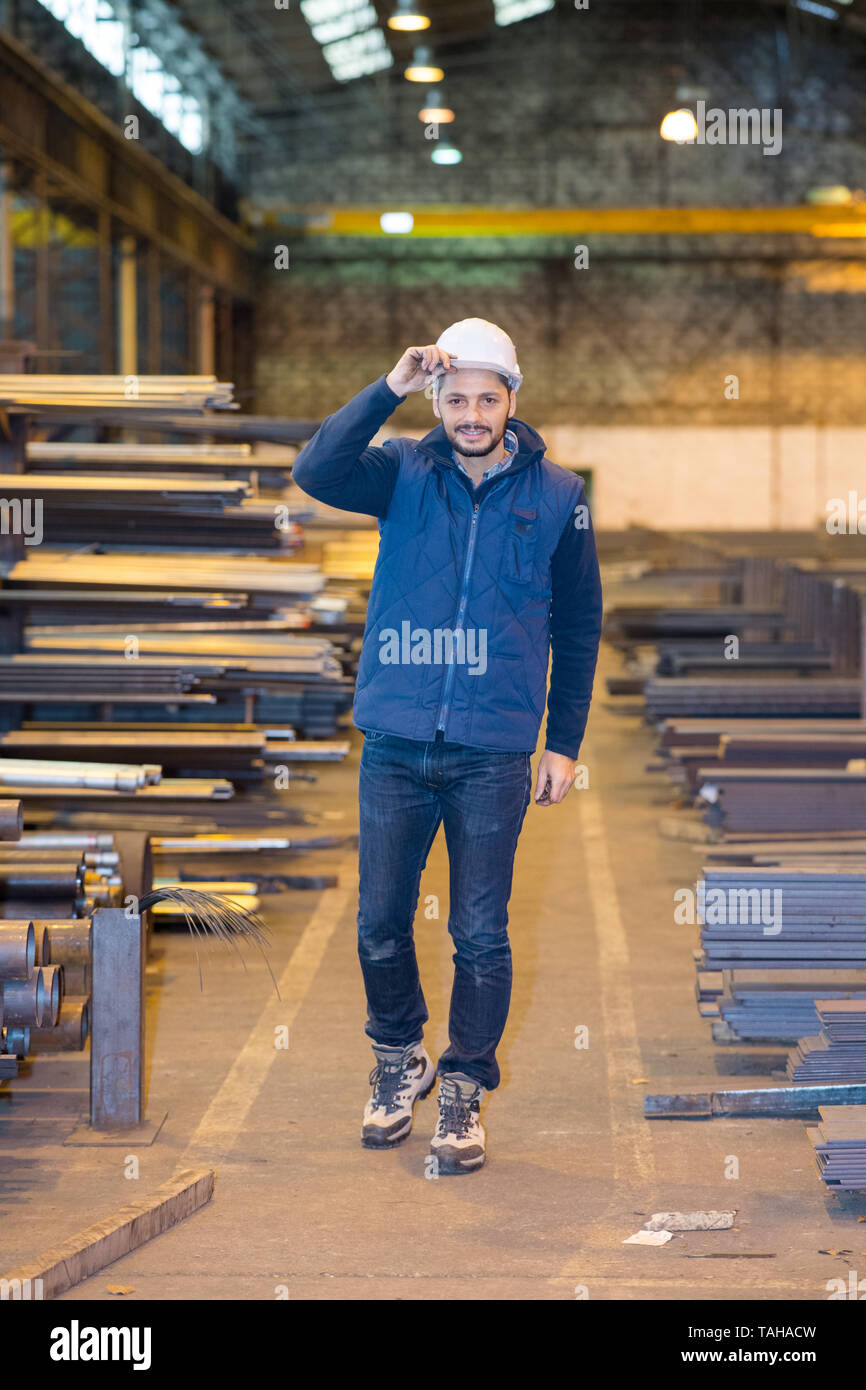 construction workers walking in the factory Stock Photo - Alamy