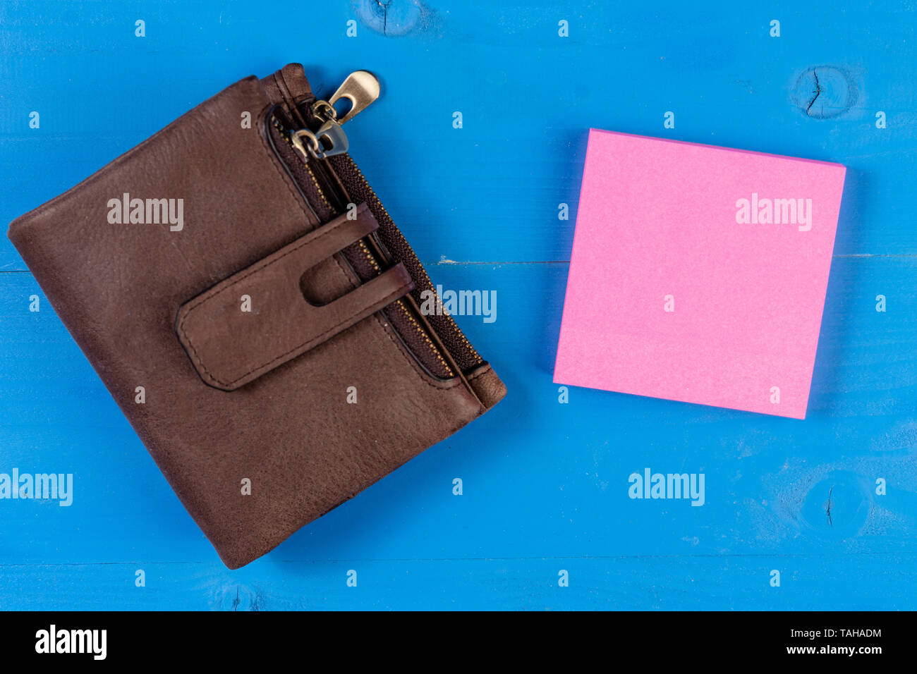Front view leather coin purse wallet colored sticky notes wooden ...