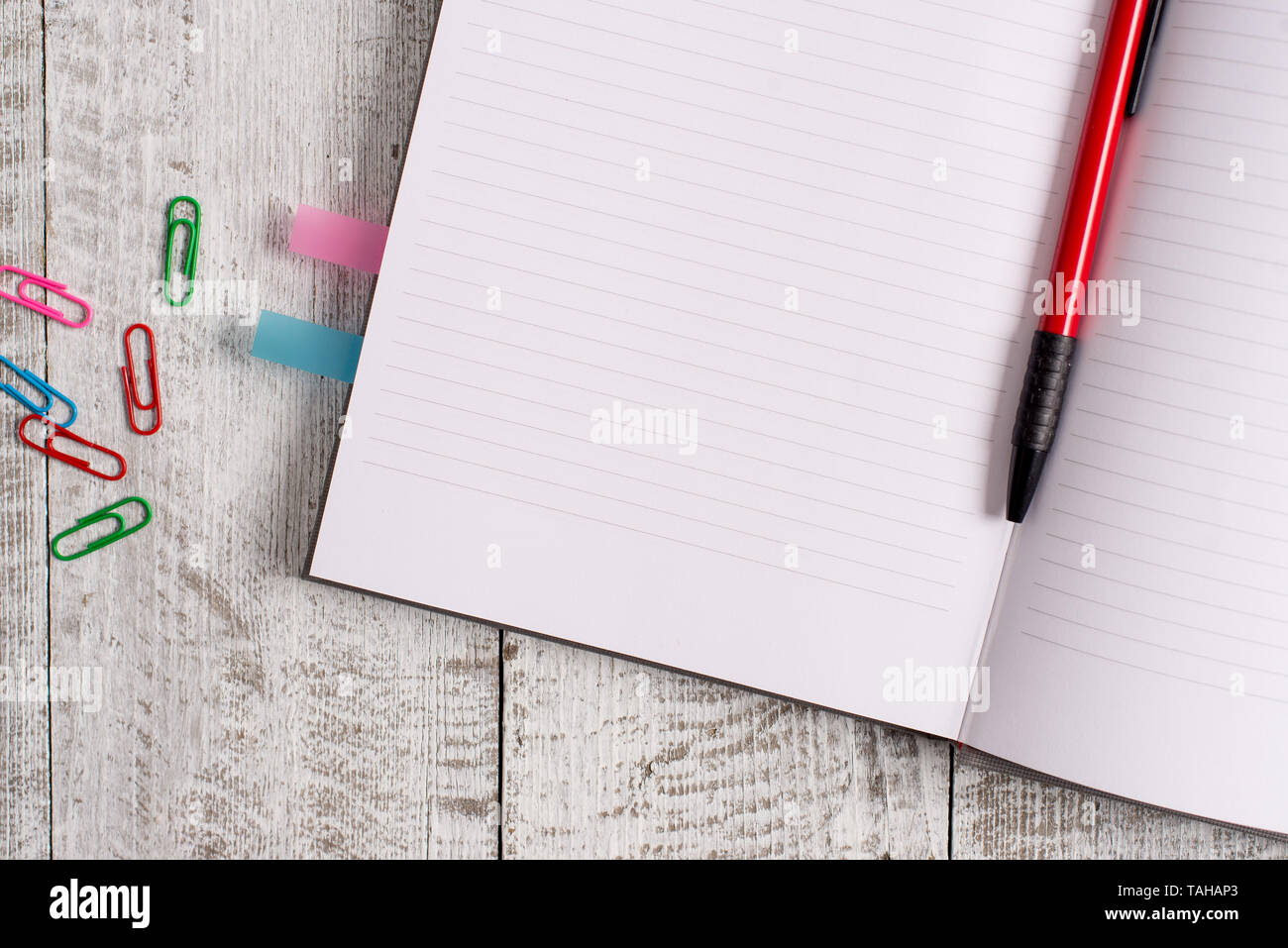 Thick pages notebook stationary placed above classic look wooden ...