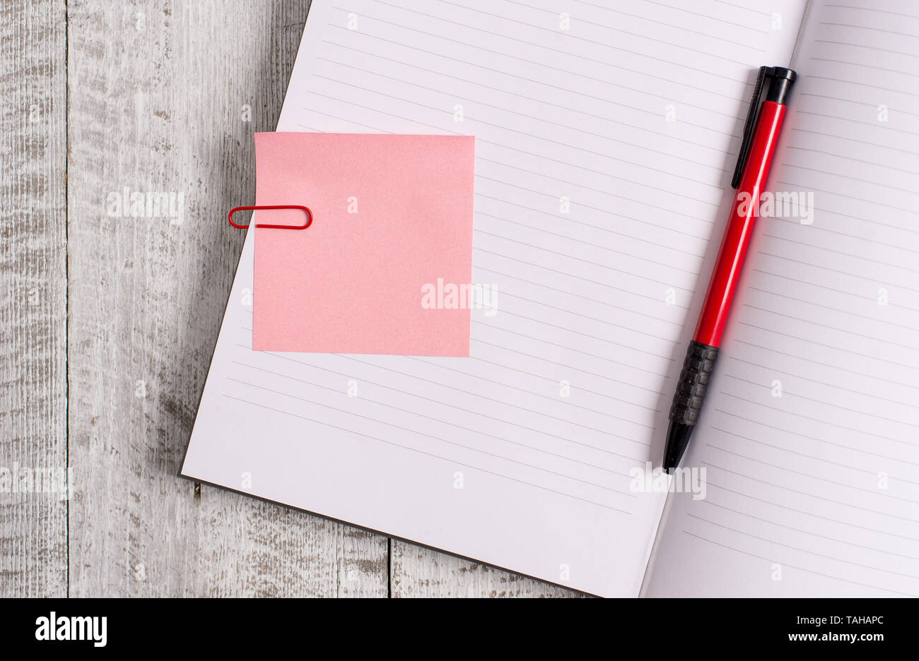 Thick pages notebook stationary placed above classic look wooden ...