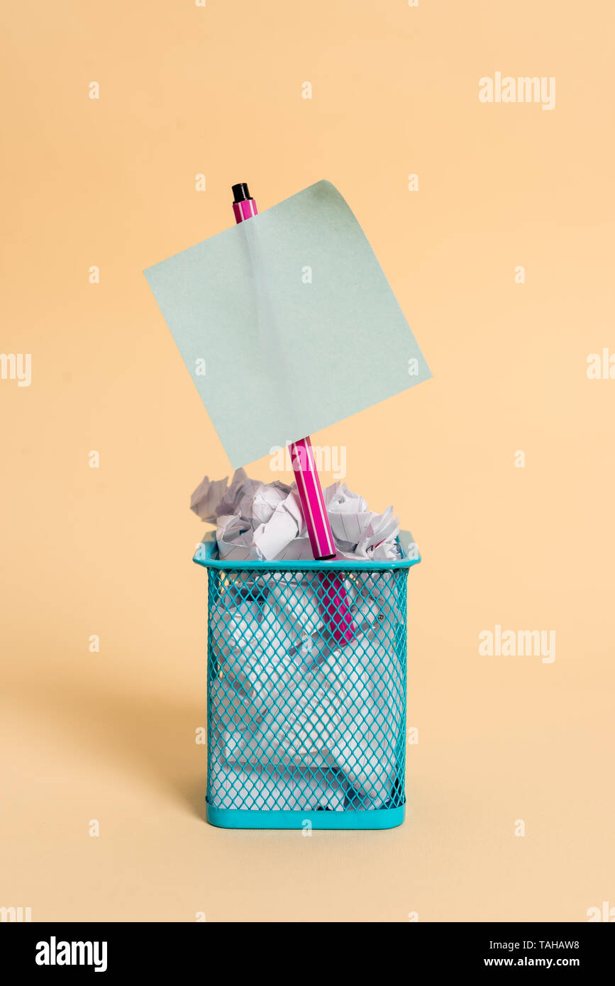 crumpled paper trash and stationary with note paper placed in the trash ...