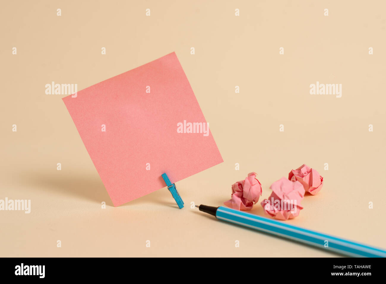 Plain note paper and stationary placed above soft pastel colour ...