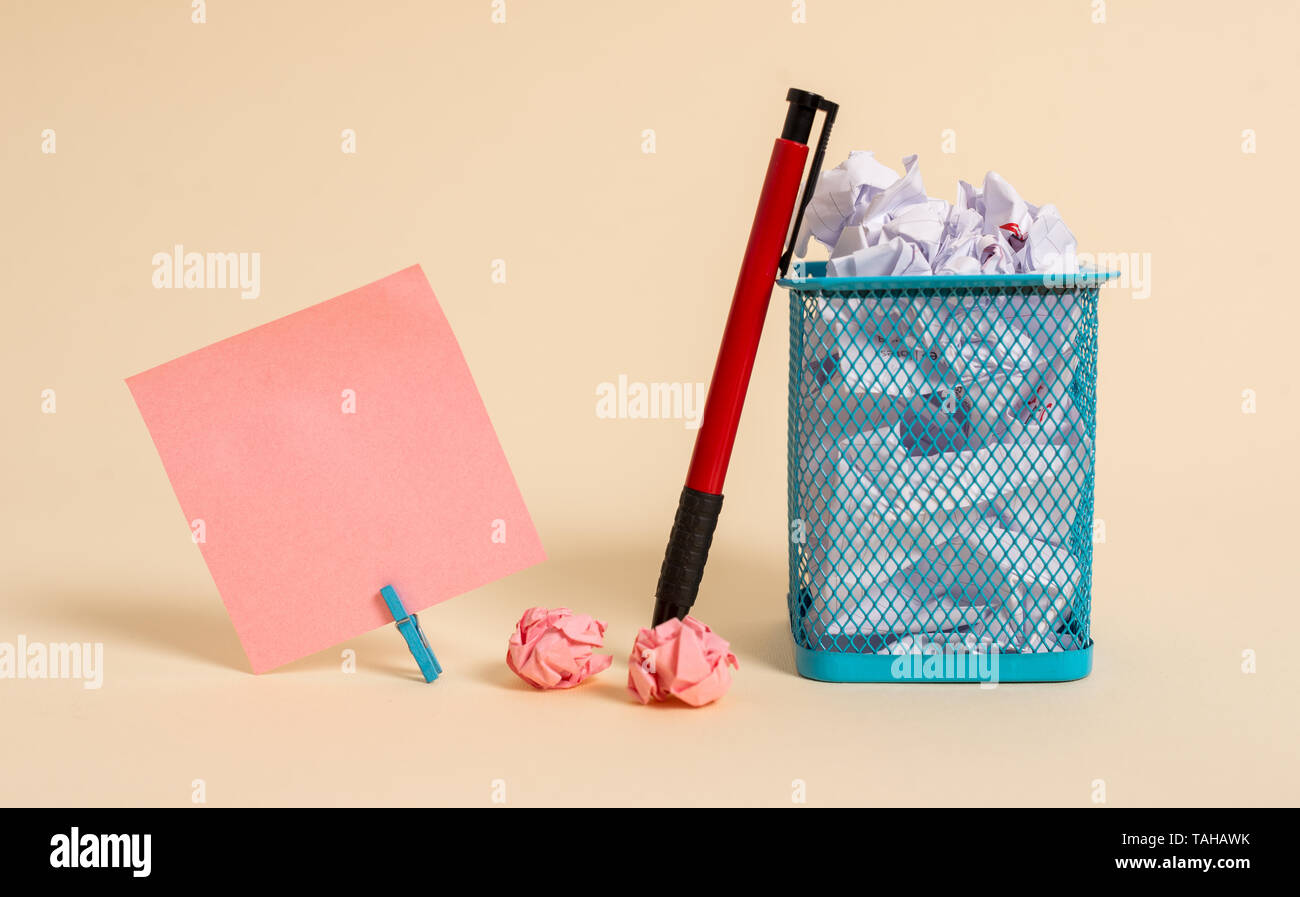 Plain note paper and stationary placed above soft pastel colour ...