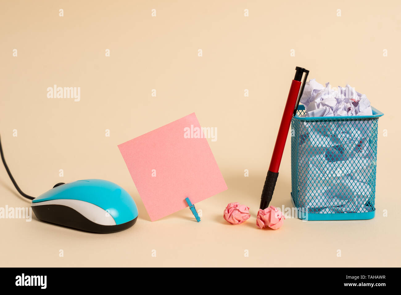 Plain note paper and stationary placed above soft pastel colour ...