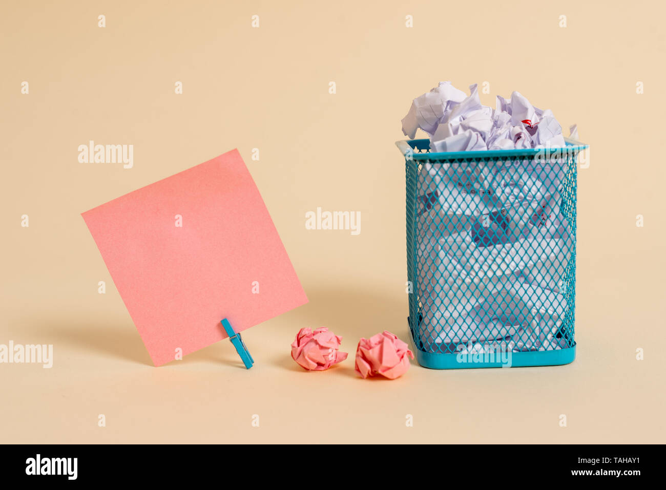 Plain note paper and stationary placed above soft pastel colour ...