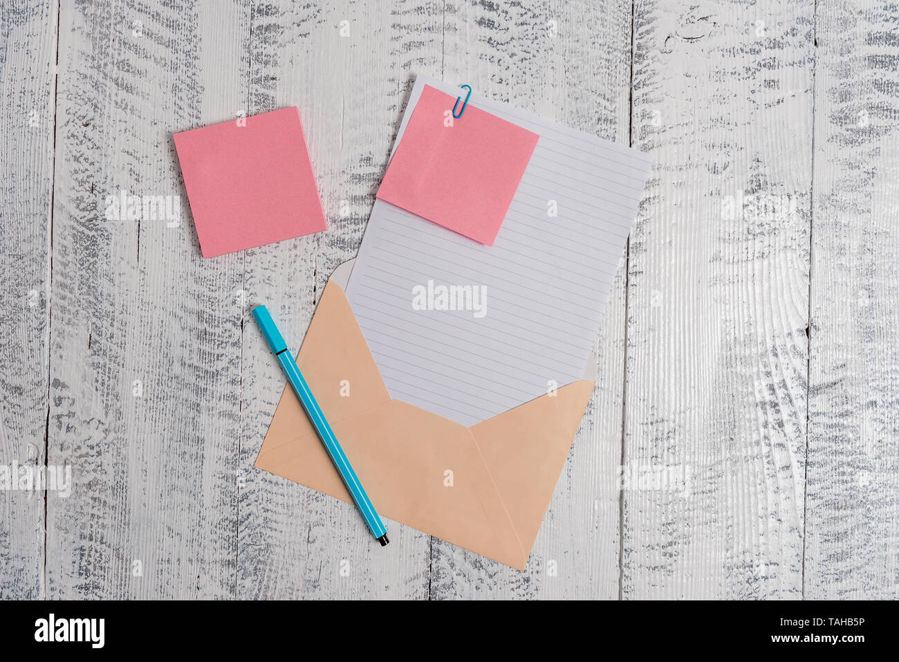 Envelope blank sheet letter paper sticky note ballpoint wooden ...