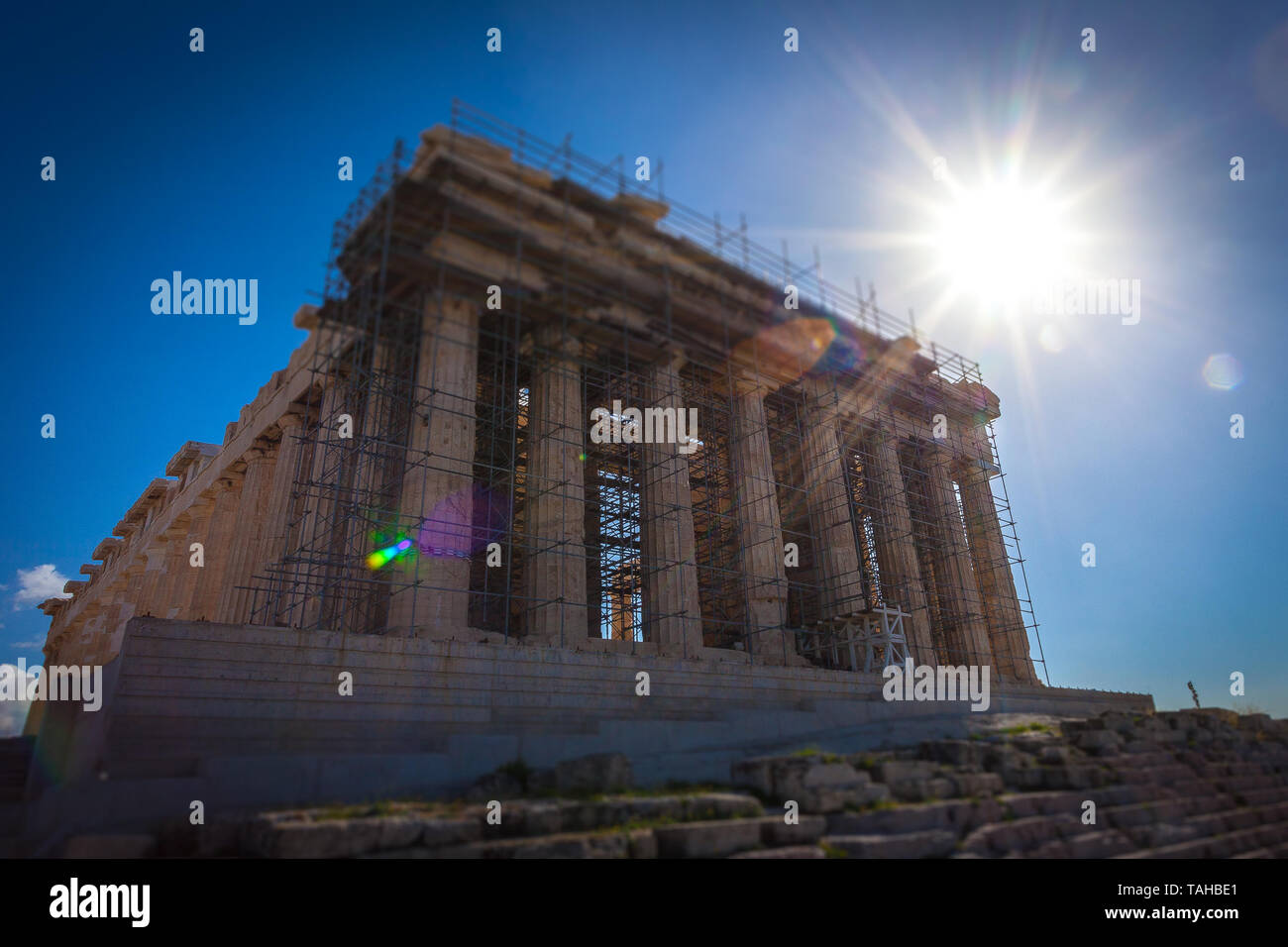 Tilt shift effect of the Parthenon with the rays of the sun in the background, Athens, Greece ...