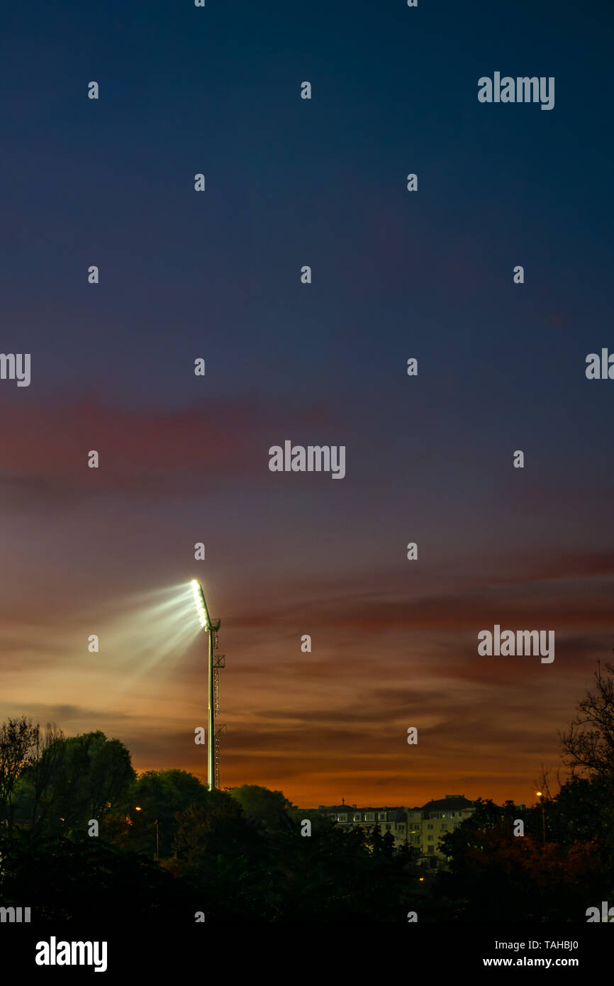 Spotlight pole at sunset Stock Photo - Alamy