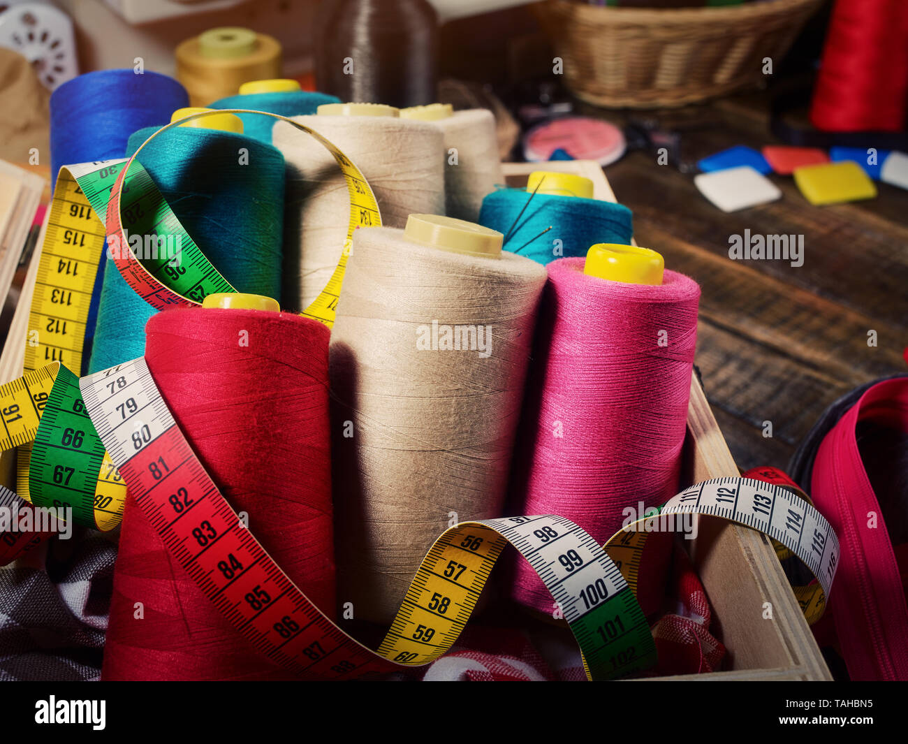 Coil threads for overlock and measuring band in sewing supplies Stock ...