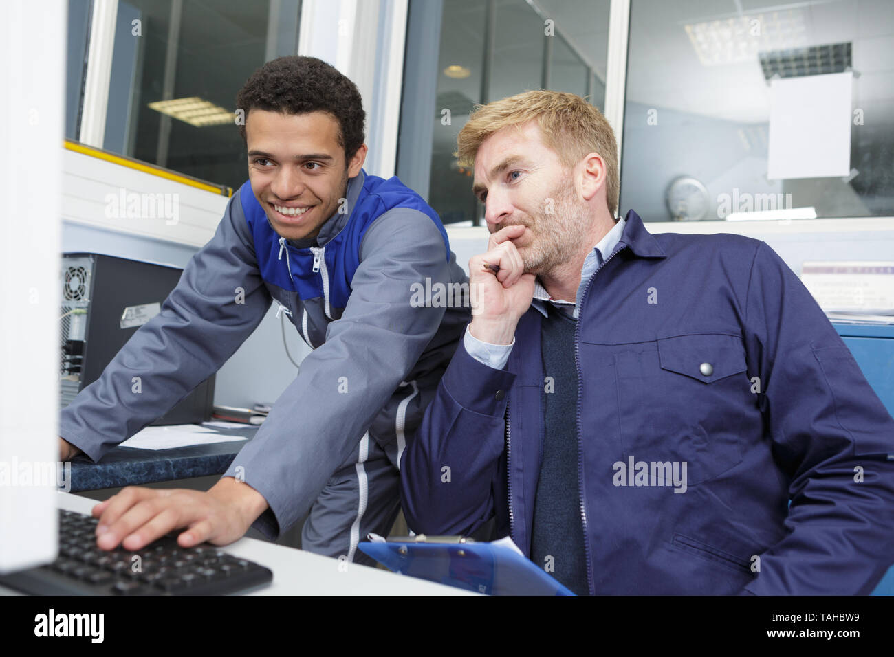 two men discussing work Stock Photo - Alamy