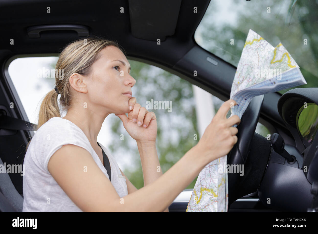 Tourist girl using map in hi-res stock photography and images - Alamy