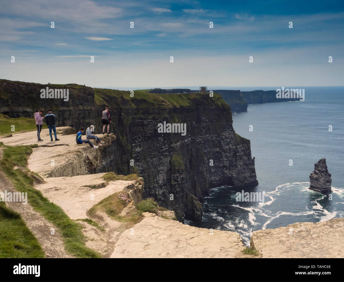 View along the Cliffs of Moher north of the Visitor Centre with youths ...