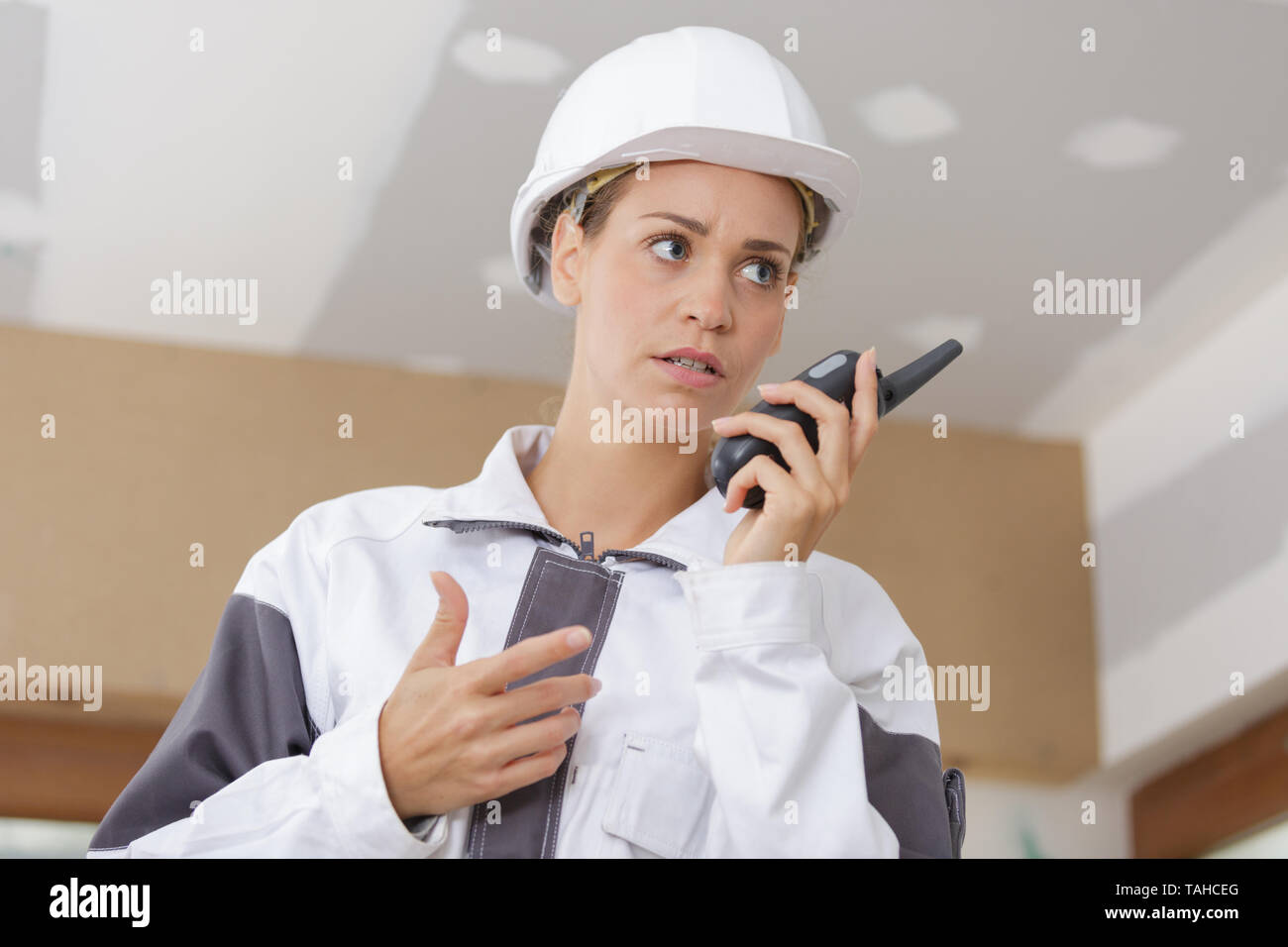 Female worker using walkie talkie hi-res stock photography and images ...