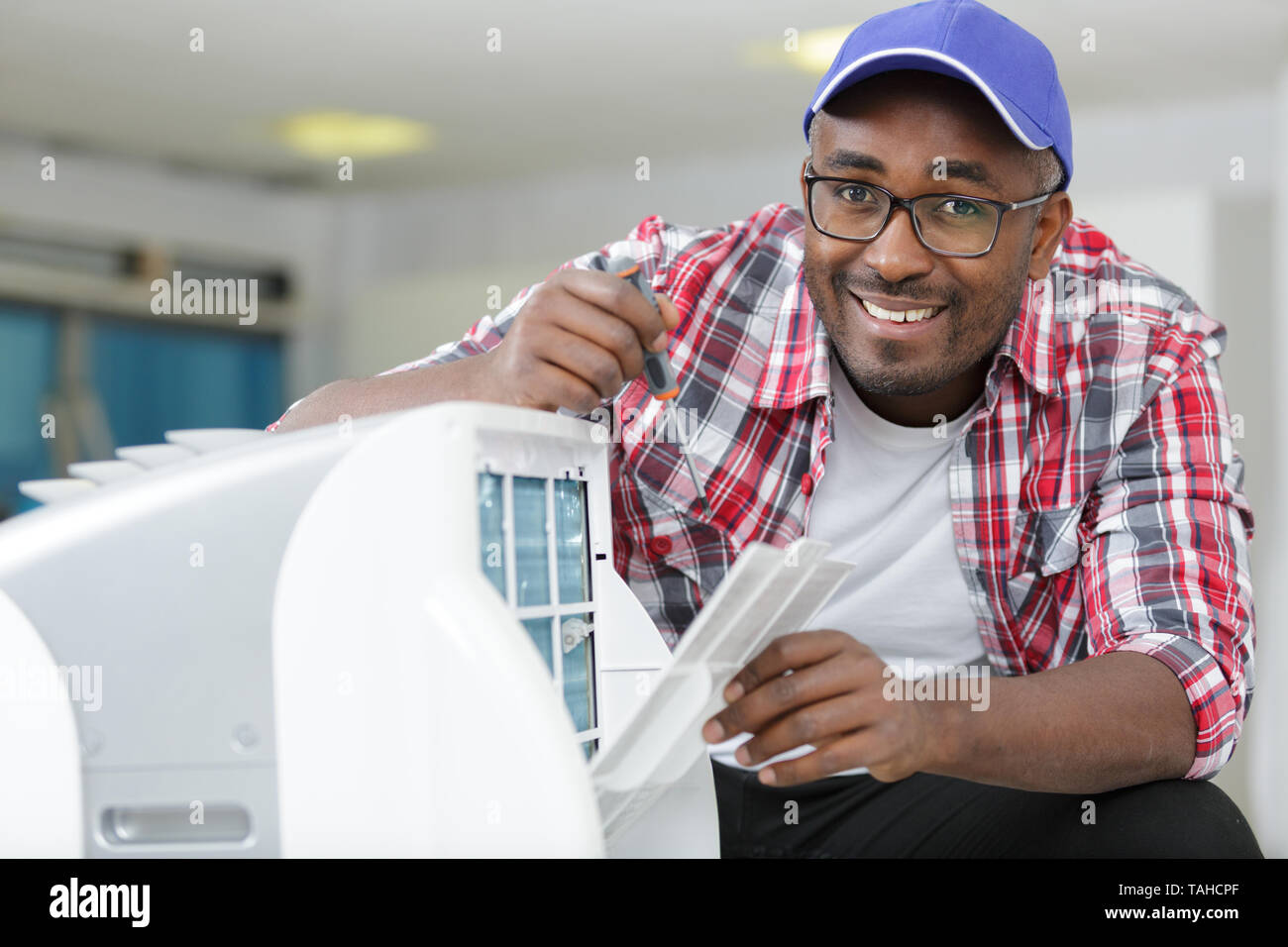 fixing and maintaining air conditioning system Stock Photo - Alamy