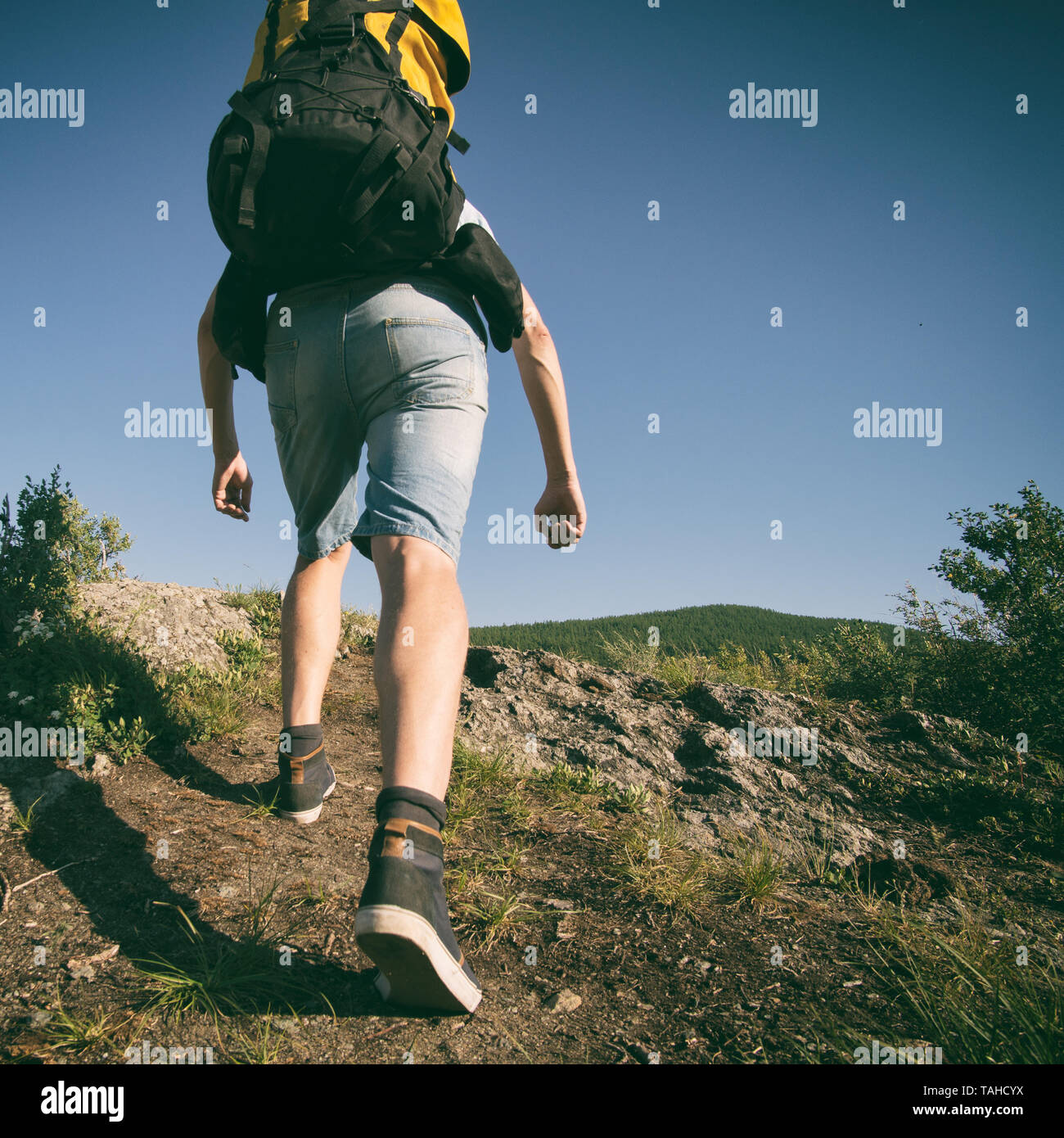 Young man running on the rocks hi-res stock photography and images - Alamy