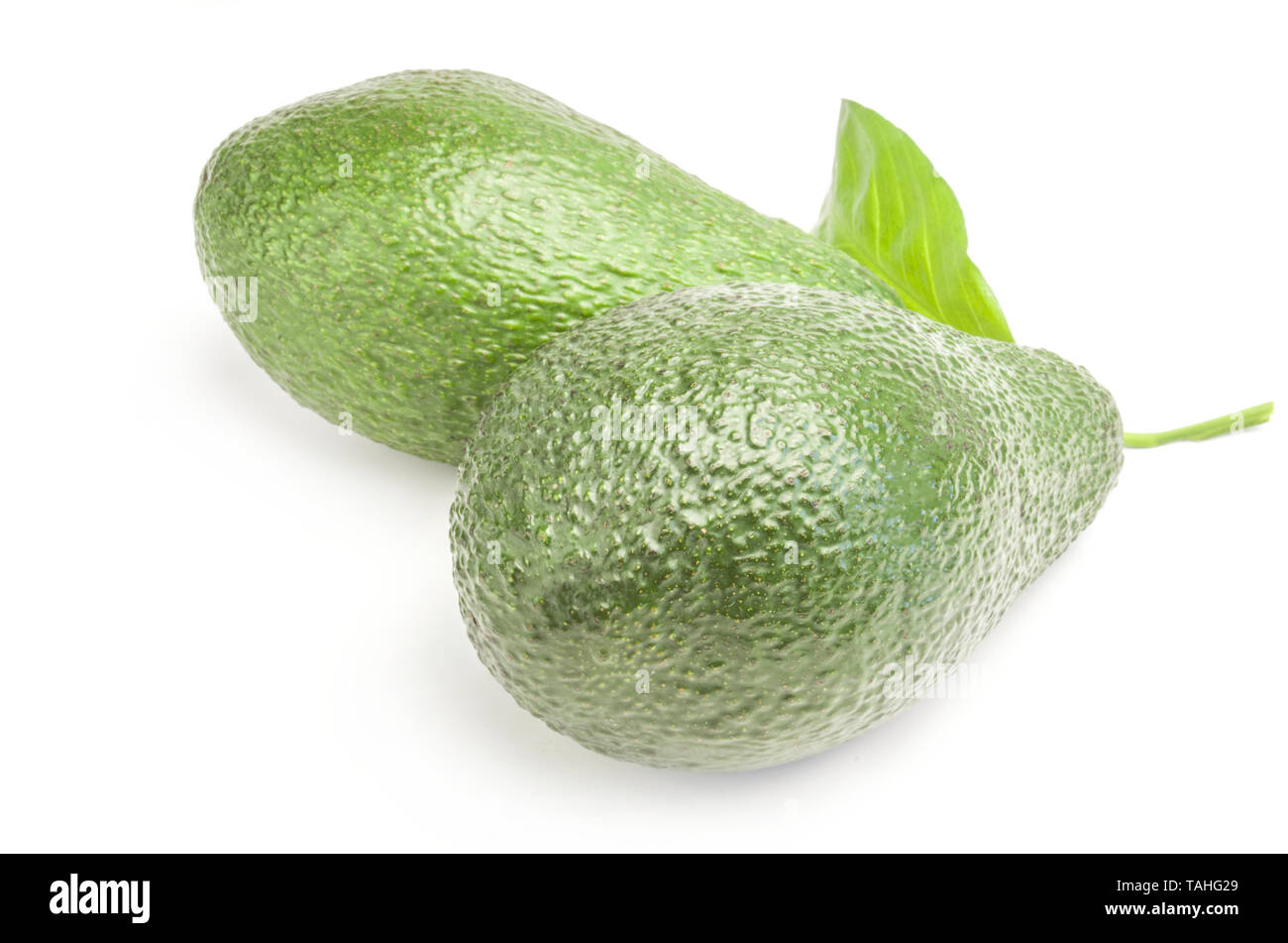 Green avocado isolated on a white cutout Stock Photo - Alamy