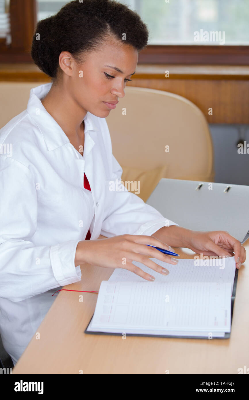 Focused woman reading record hi-res stock photography and images - Alamy