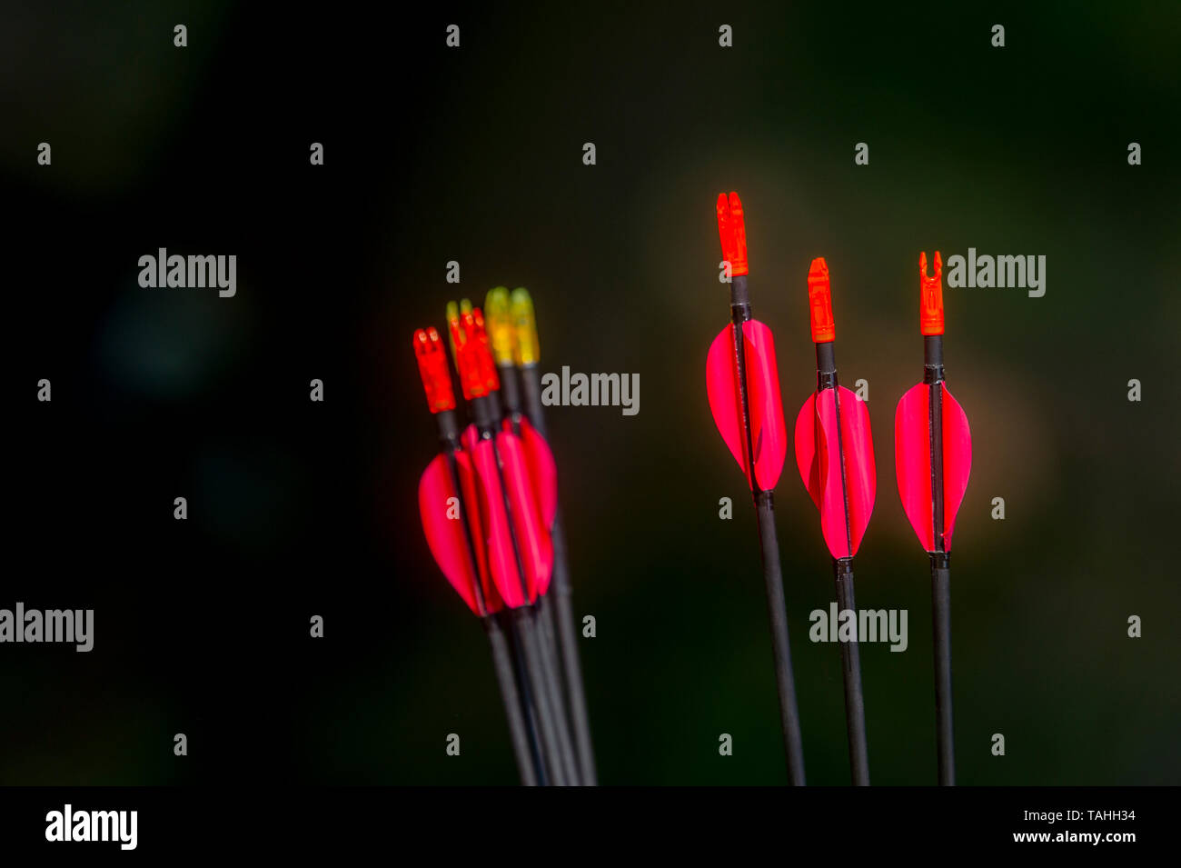 archery arrows on a black background Stock Photo - Alamy