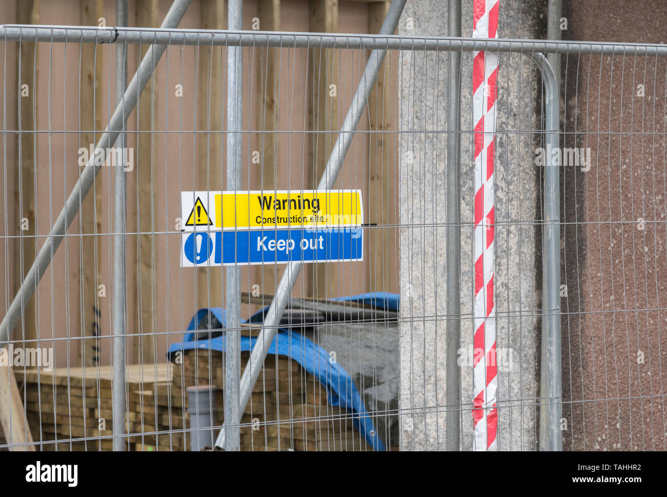Health and Safety warning sign on building construction site fence ...