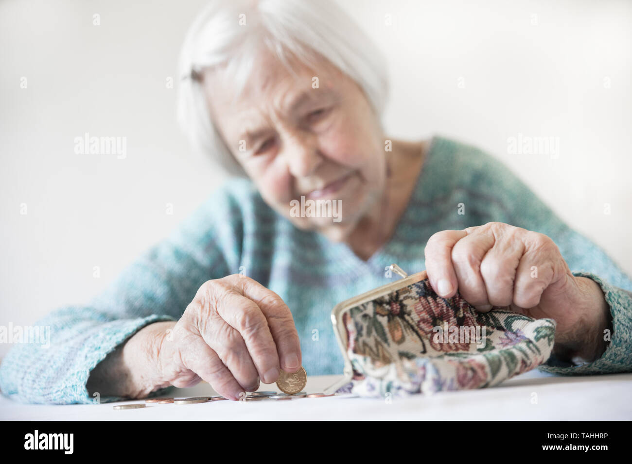Poor woman counting money hi-res stock photography and images - Alamy