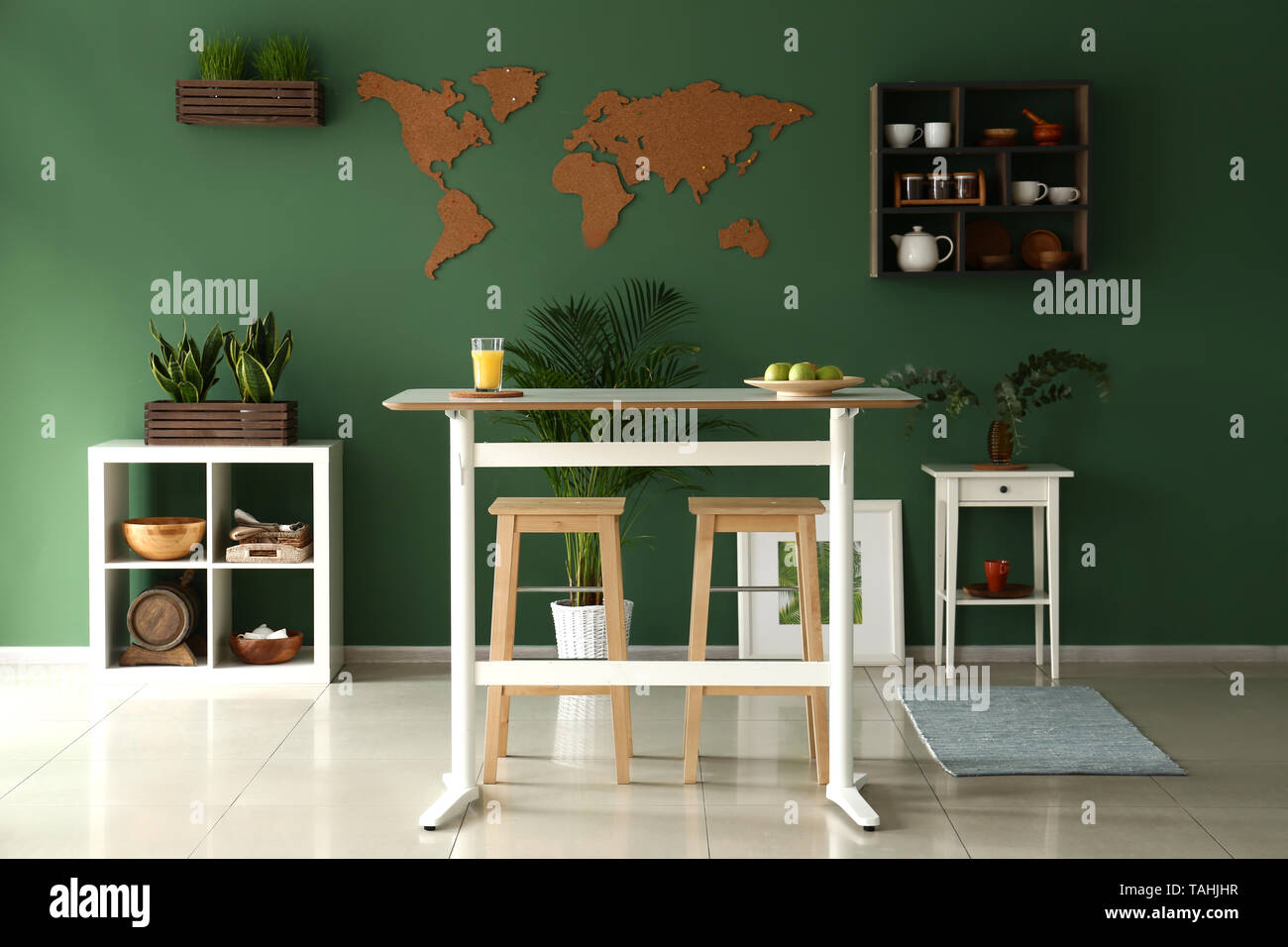 Modern interior of kitchen with stylish table Stock Photo - Alamy