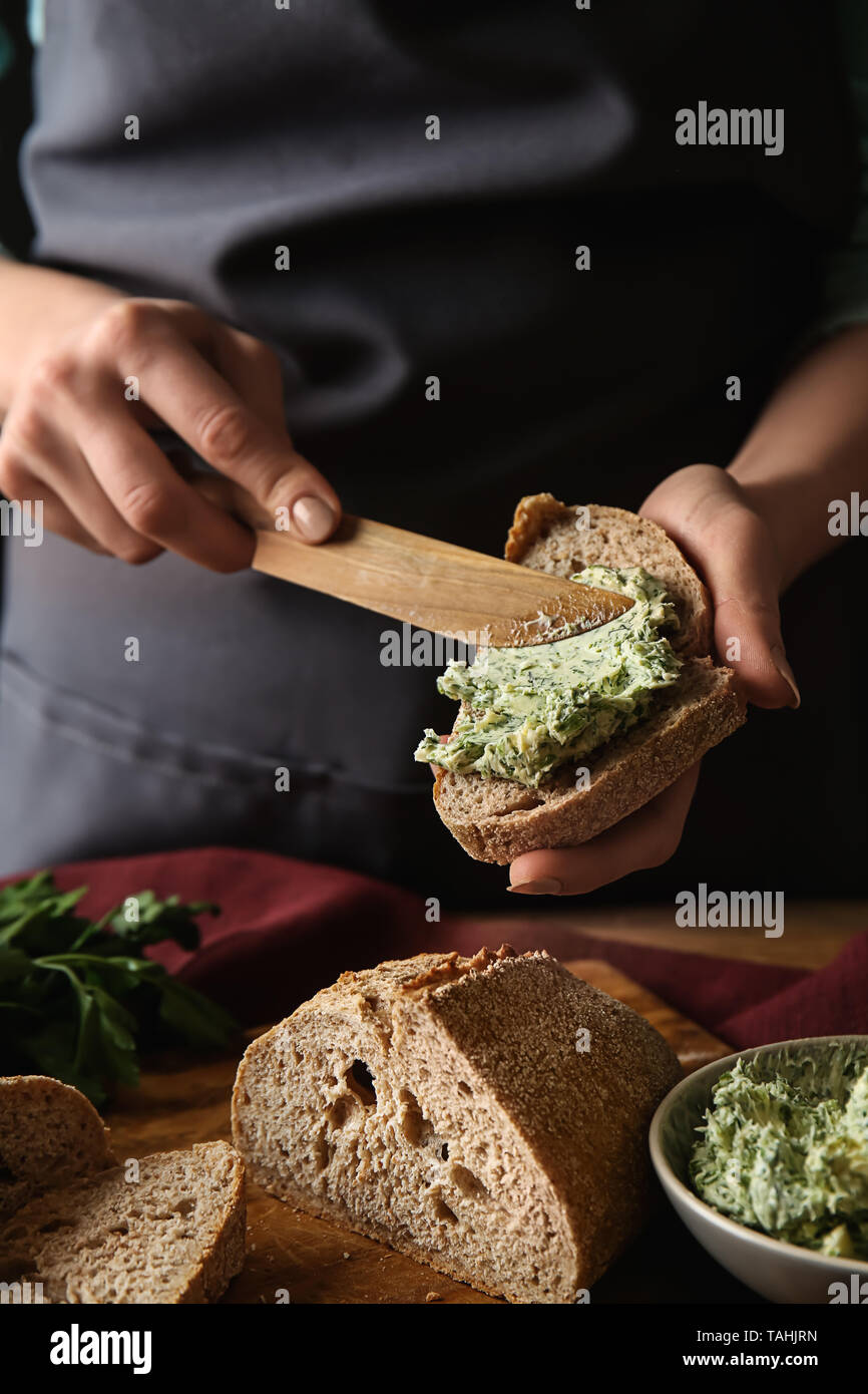 Young woman spreading butter hi-res stock photography and images - Alamy