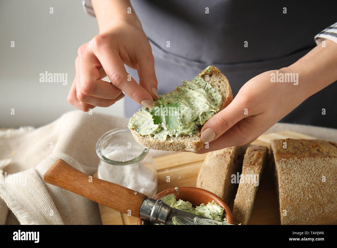 Woman eating slice bread butter hi-res stock photography and images - Alamy