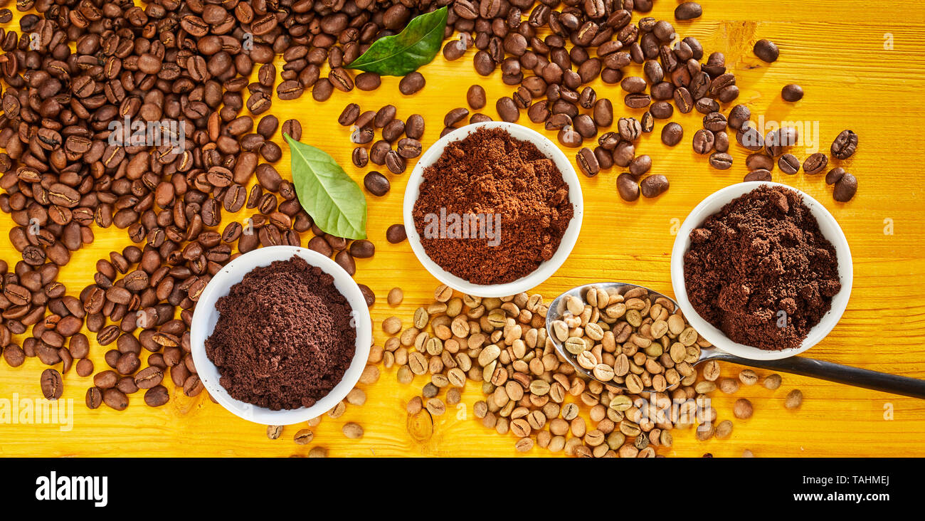 Selection of bowls of mild, medium and full roasted ground coffee with ...
