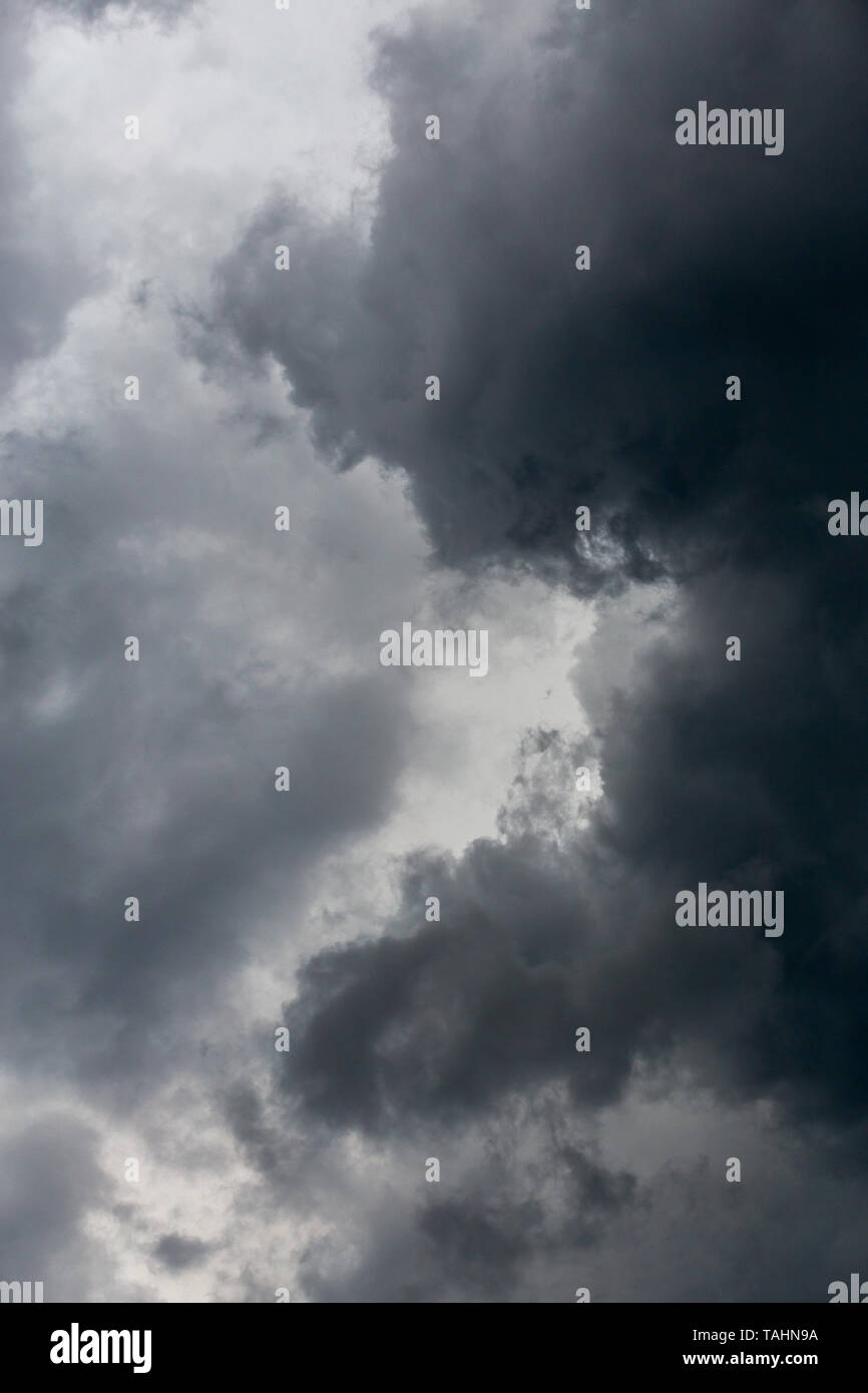 gray incoming storm clouds dark closeup backdrop, captured on 100 mm ...
