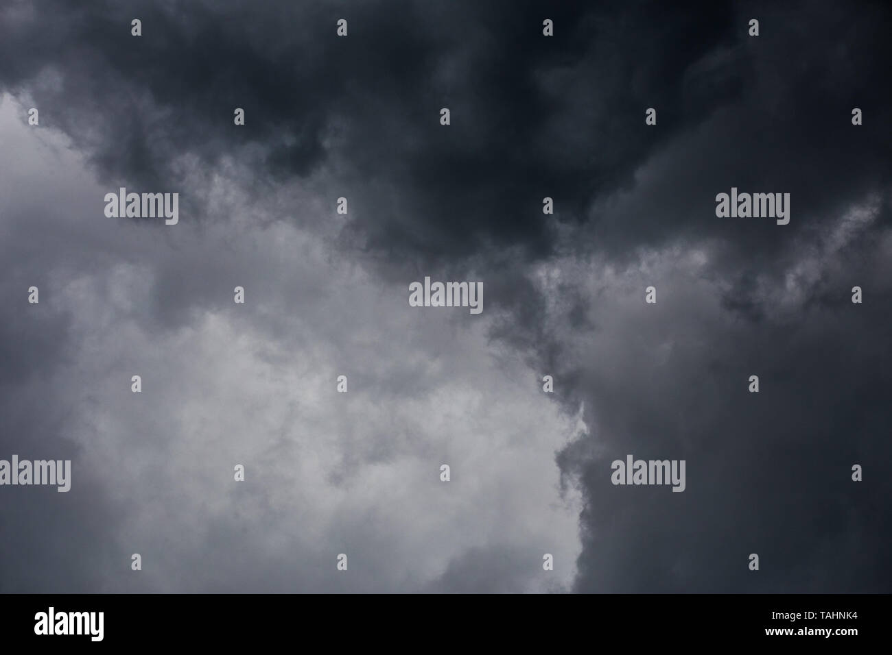 gray incoming storm clouds dark closeup backdrop, captured on 100 mm ...