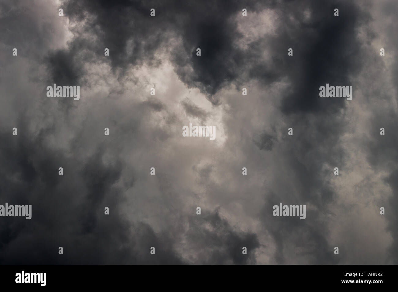 gray incoming storm clouds dark closeup backdrop, captured on 100 mm ...