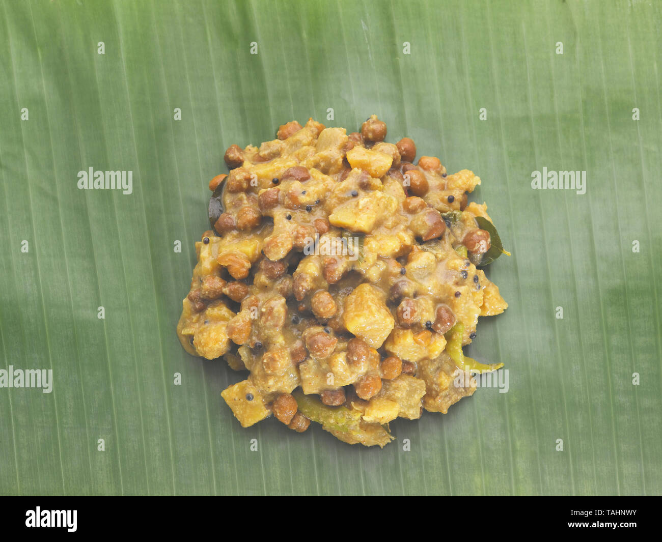 KOOTTUKARI- A VEGETABLE SERVED IN A TRADITIONAL TAMIL LUNCH ON A GREEN ...