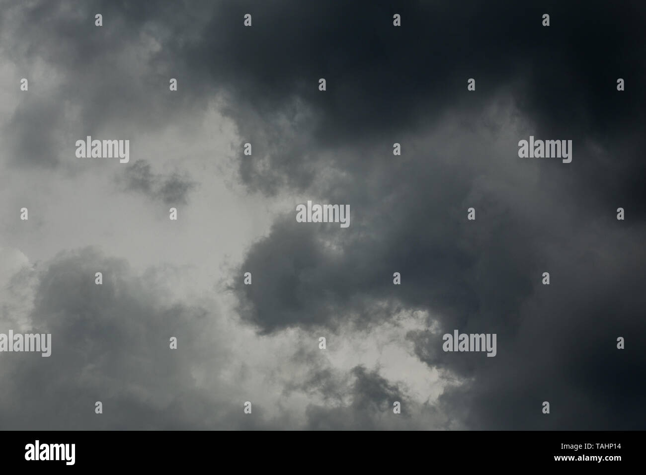 gray incoming storm clouds dark closeup backdrop, captured on 100 mm ...