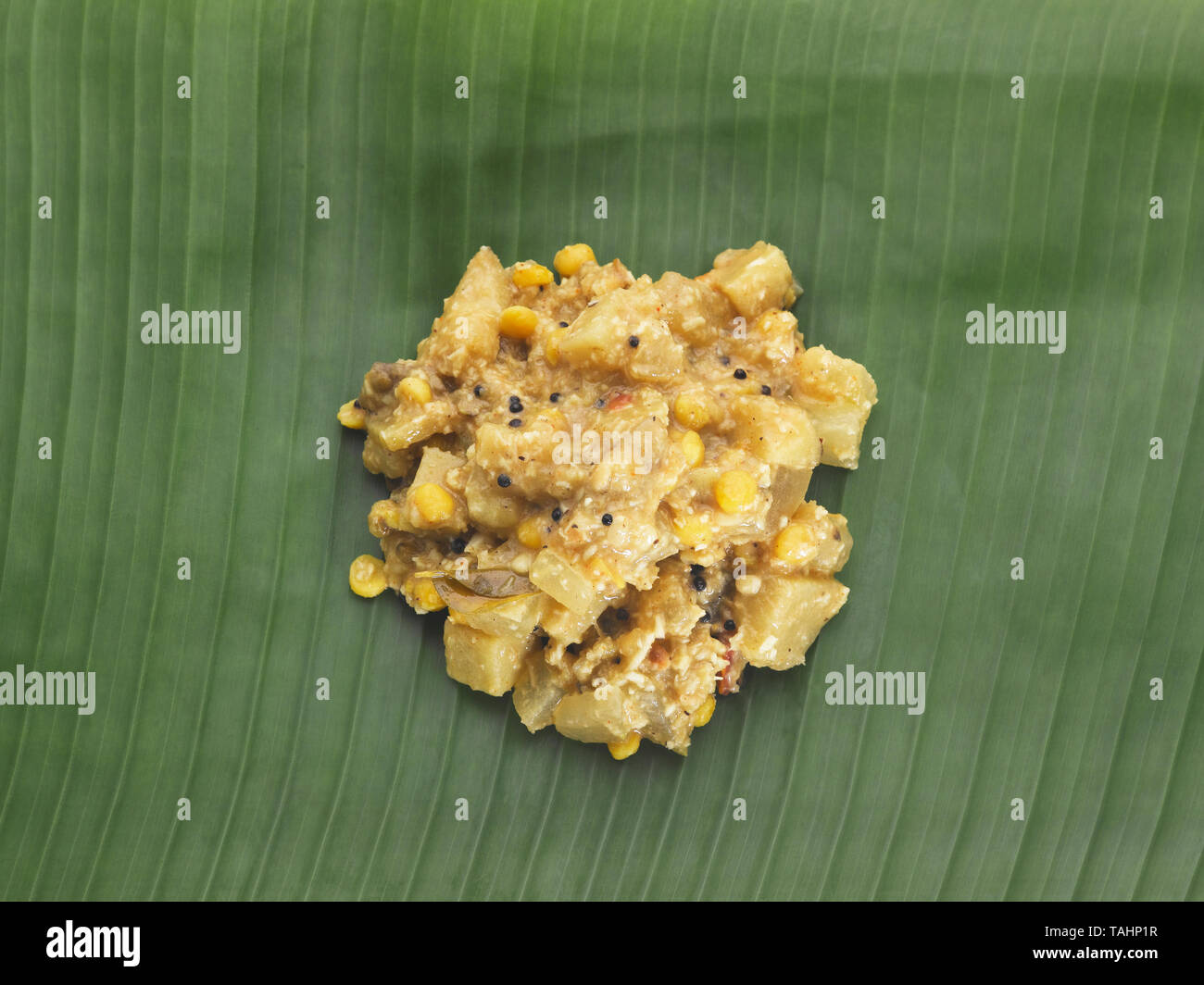 KOOTTUKARI- A VEGETABLE SERVED IN A TRADITIONAL TAMIL LUNCH ON A GREEN ...