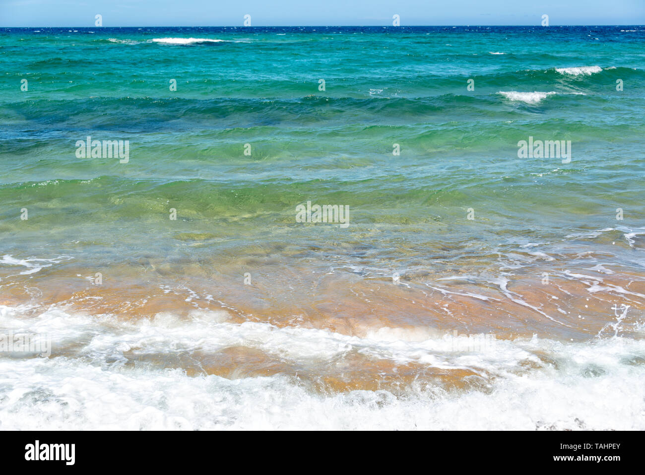 Beach clear ocean waves hi-res stock photography and images - Alamy