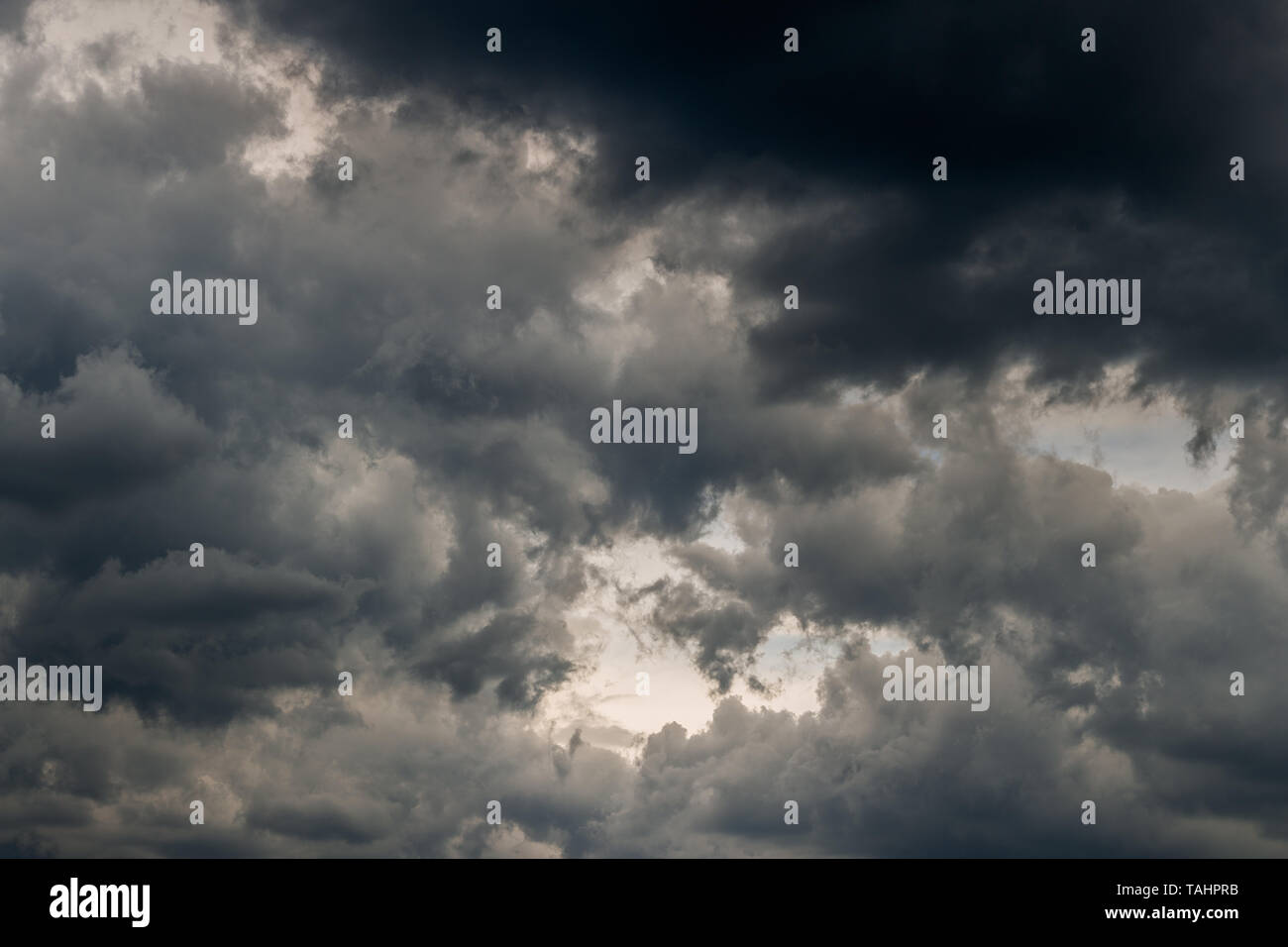 grey incoming storm clouds dark closeup backdrop, captured with normal ...