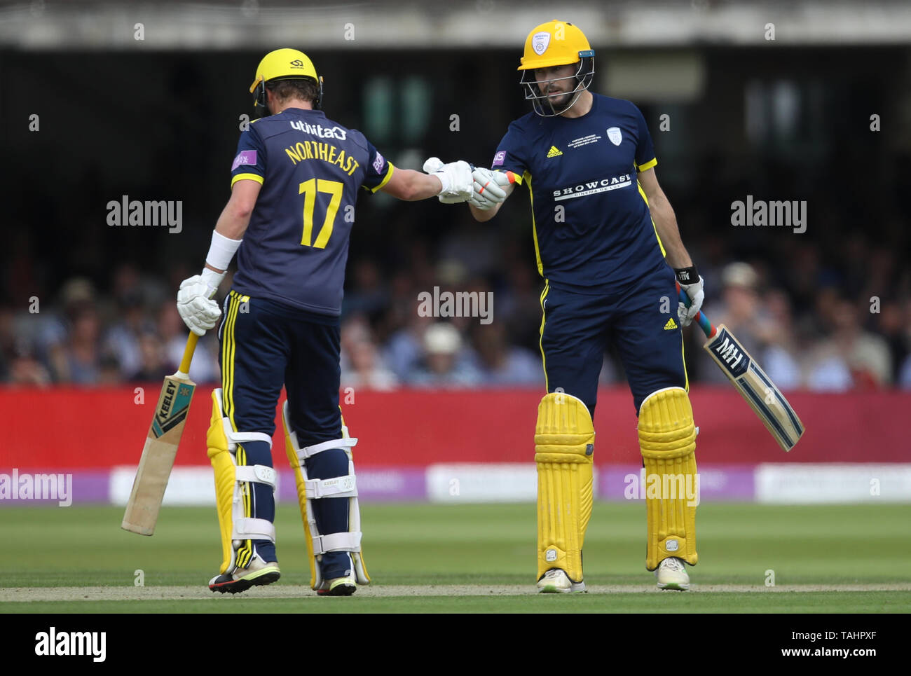 Hampshire's Sam Northeast (left) greets James Fuller after reaching 50 ...